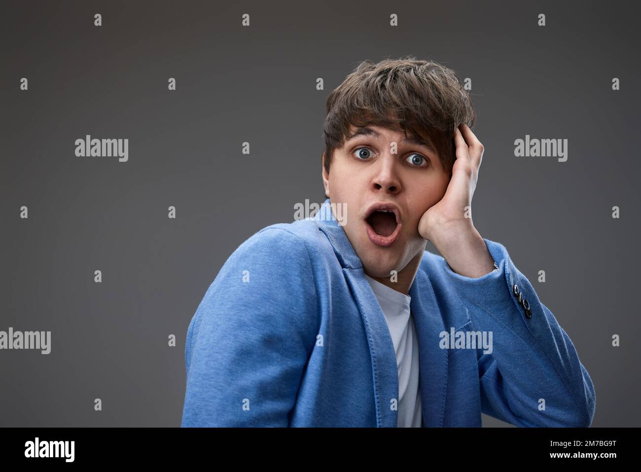 shocked man with surprise expression and excited face Stock Photo - Alamy