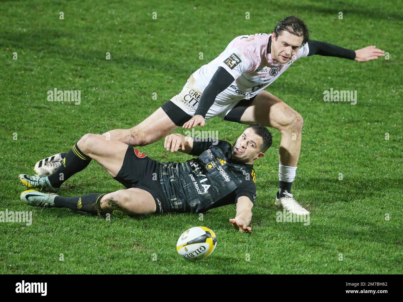 Brice Dulin of Stade Rochelais and Pierre-Louis Barassi of Stade ...