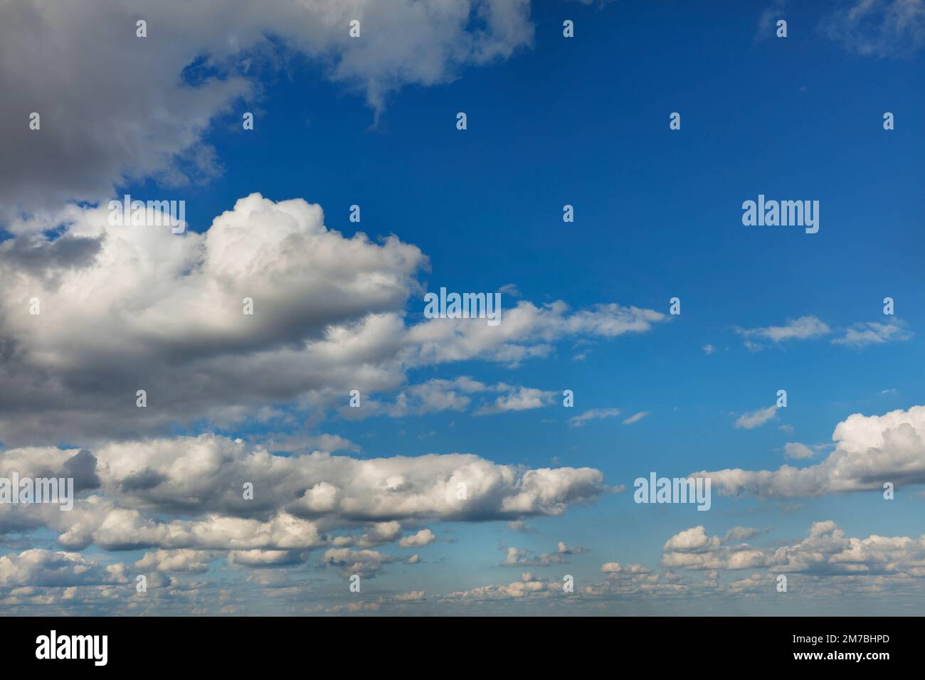 Landscape of beautiful dense white clouds in the blue sky with a ...