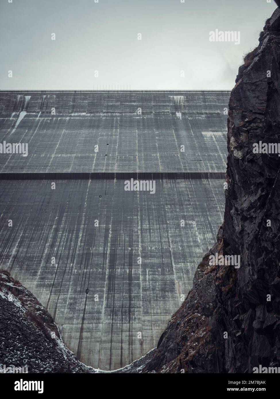 Amazing drone footage over an alpine lake, hydro dam and vast Alpine ...