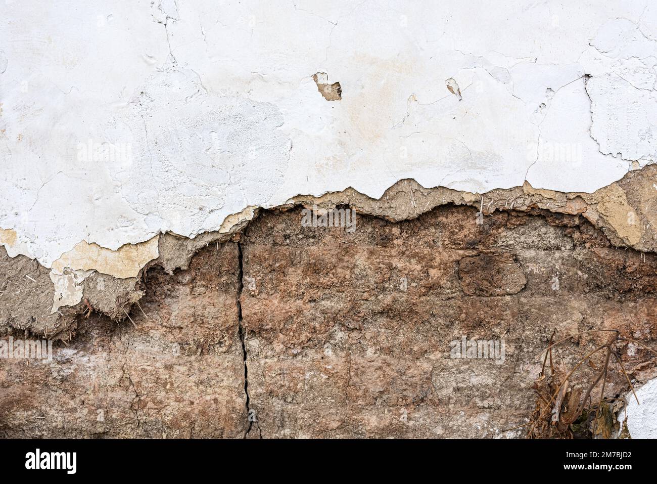 Old damaged mudbrick wall of an old ruined house as background Stock ...