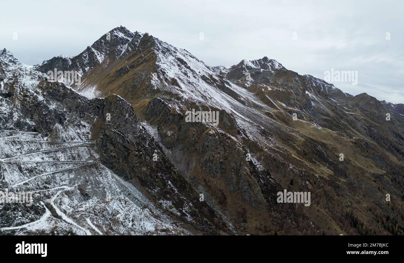 Amazing drone footage over an alpine lake, hydro dam and vast Alpine ...
