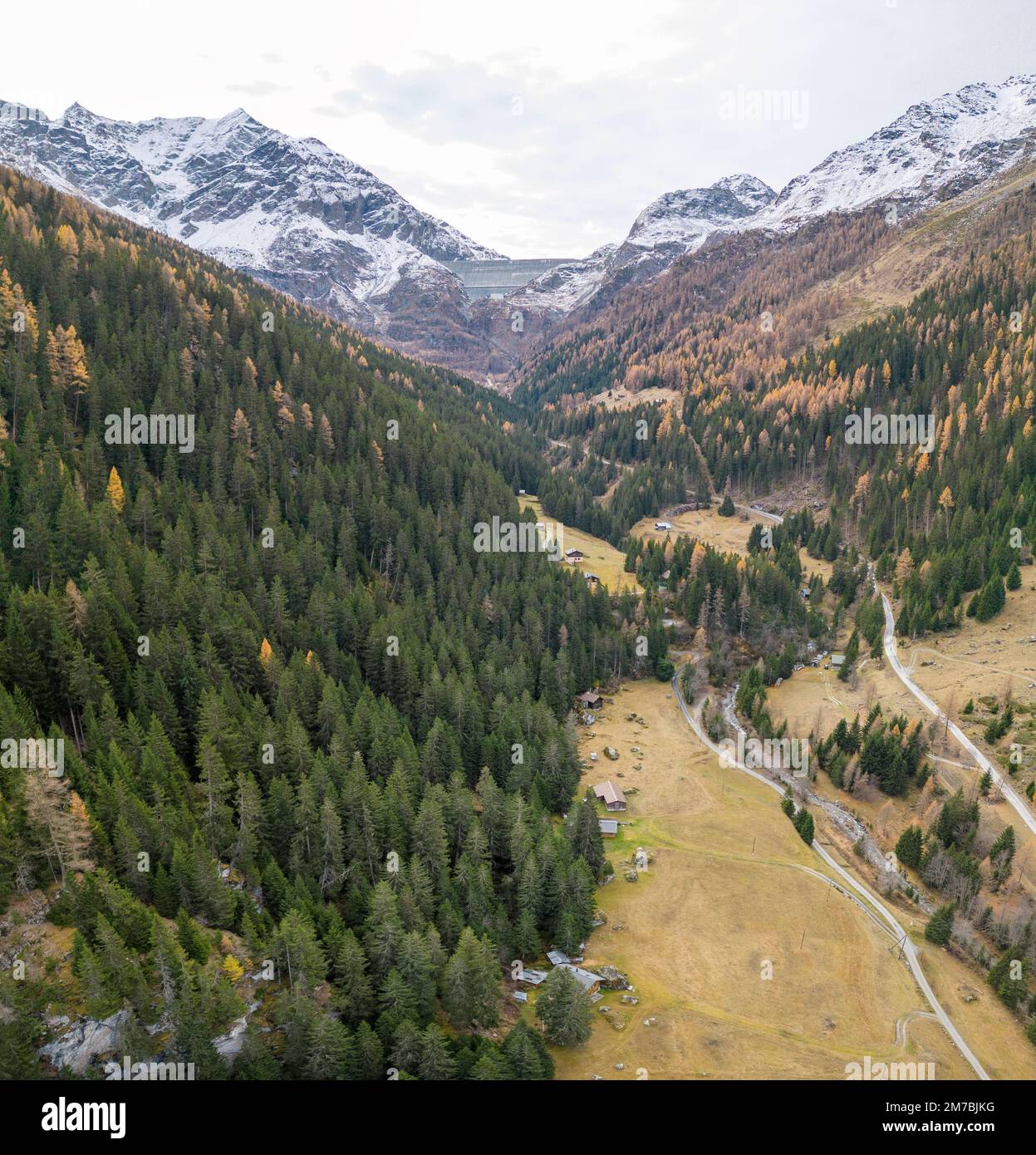 Stunning drone footage of an alpine valley in Autumn with different ...