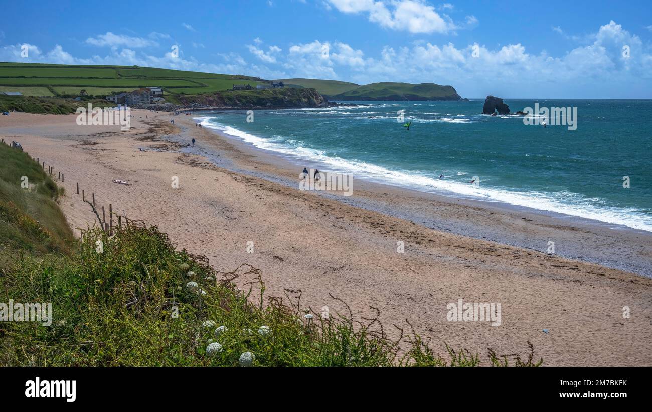 Couples walk on the sand at South Milton Beach, Devon, UK Stock Photo ...