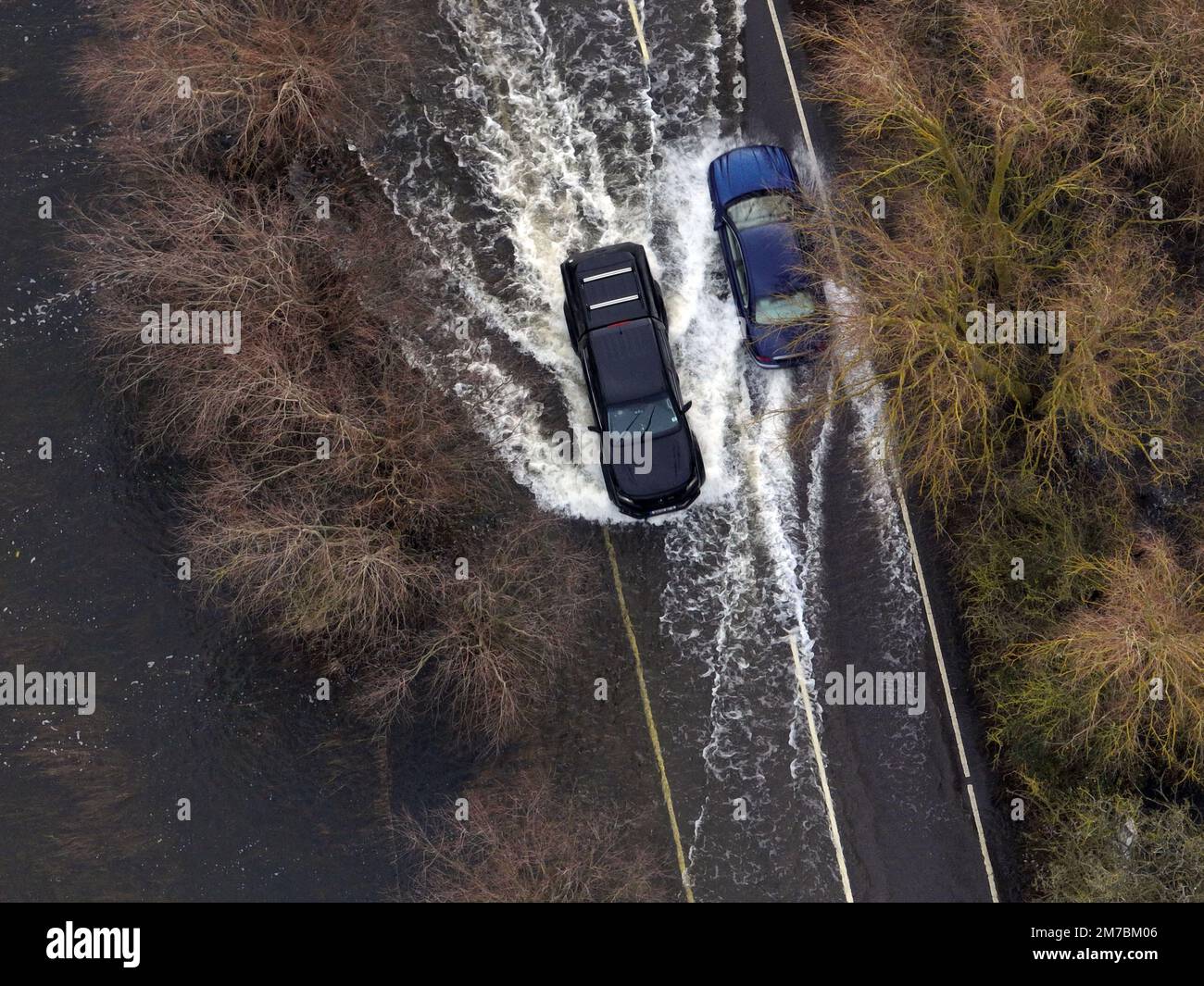 The Welney wash fills with floodwater and the road is becoming flooded ...