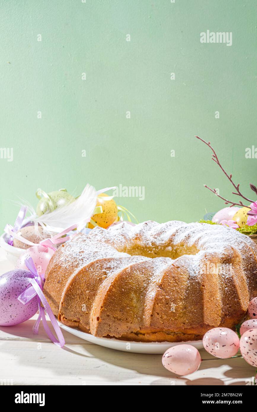 Traditional spring holiday Easter round cake topped with powdered sugar ...