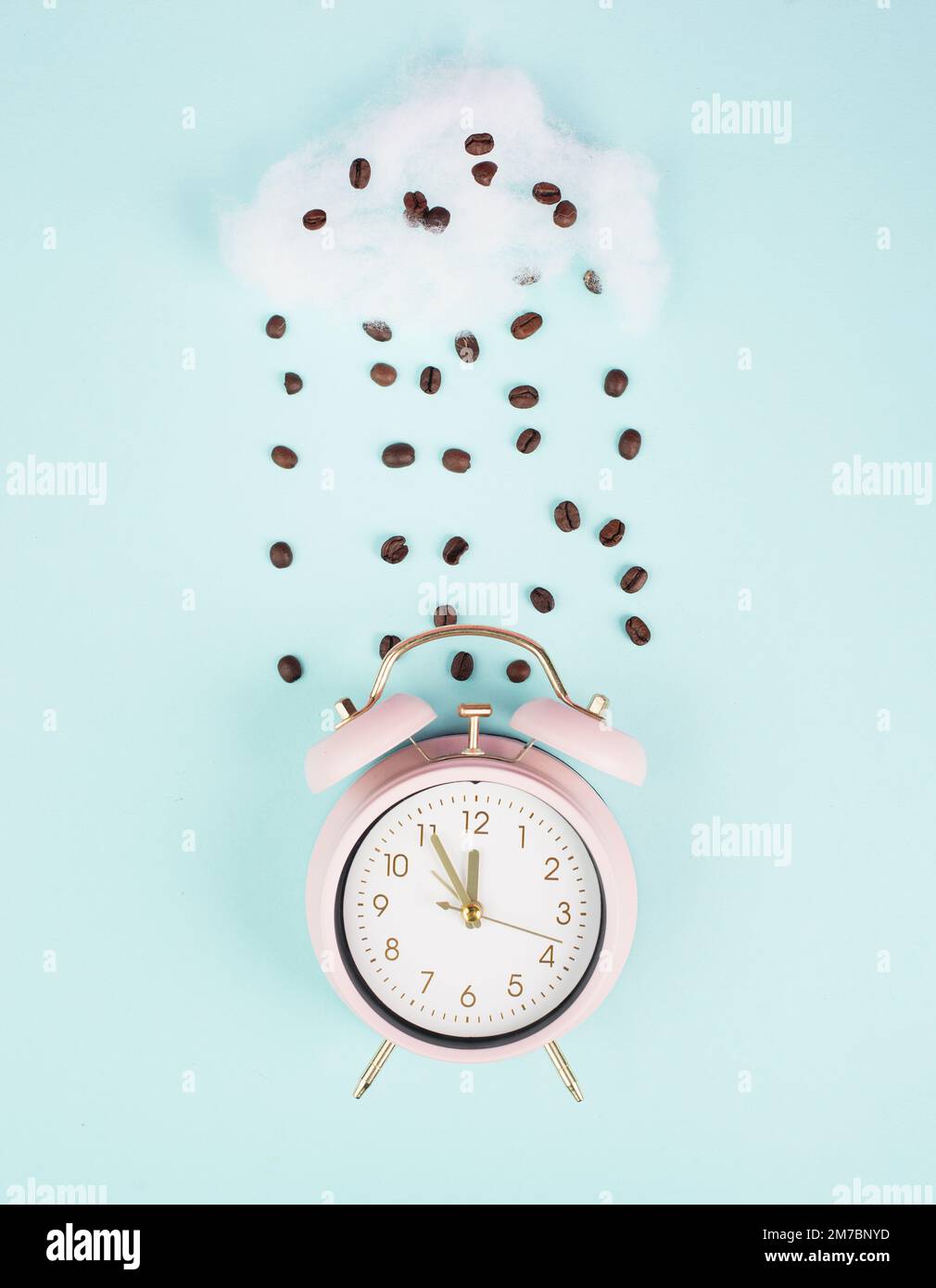 Wake up, time for a coffee break, alarm clock with roasted beans ...
