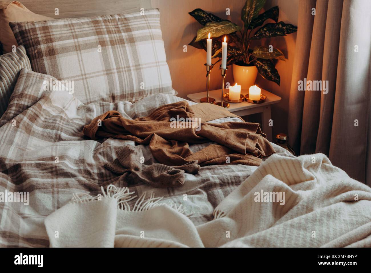 cozy scandinavian bedroom interior in natural tones, real life mess ...