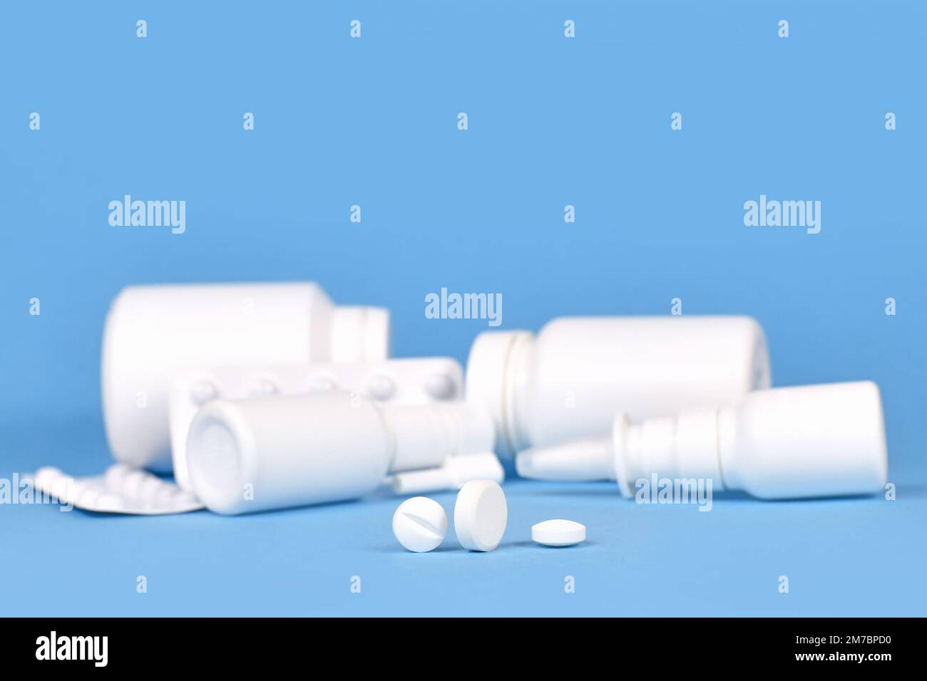 Pills with medication for cold and flue in blurry blue background Stock ...