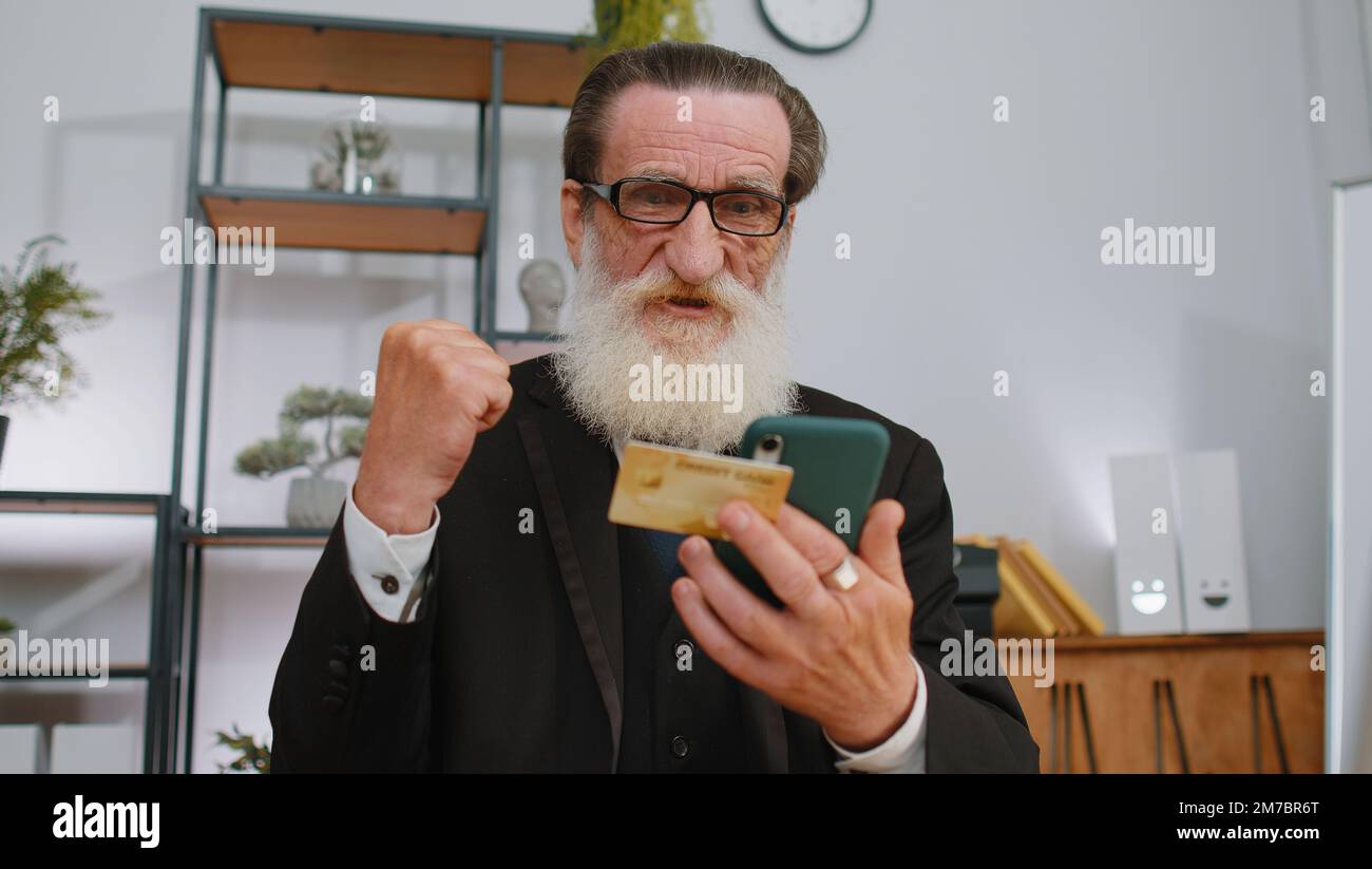 Senior businessman programmer software developer working making online ...