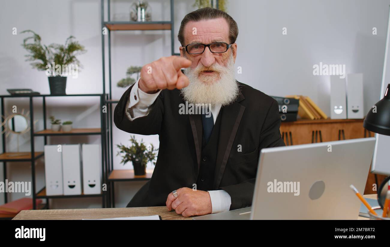 I choose you. Elderly businessman programmer software developer working ...