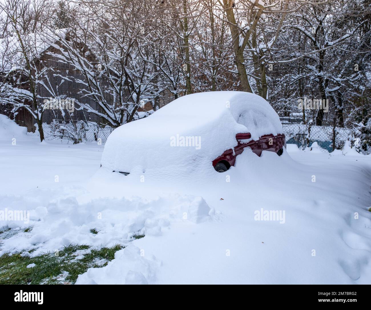 Clearing the car from a large amount of snow Stock Photo - Alamy