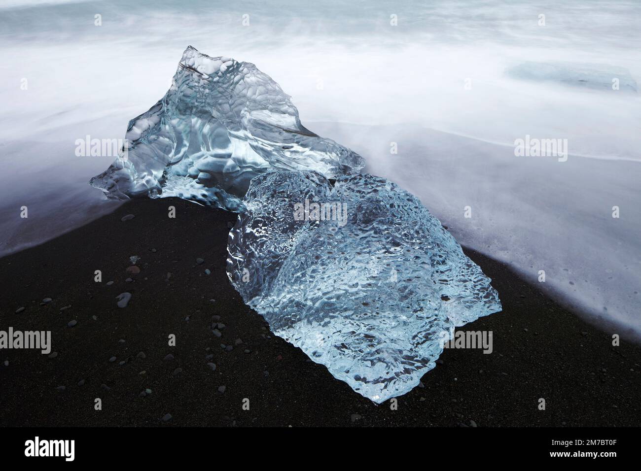Clear ice on black lava Stock Photo - Alamy