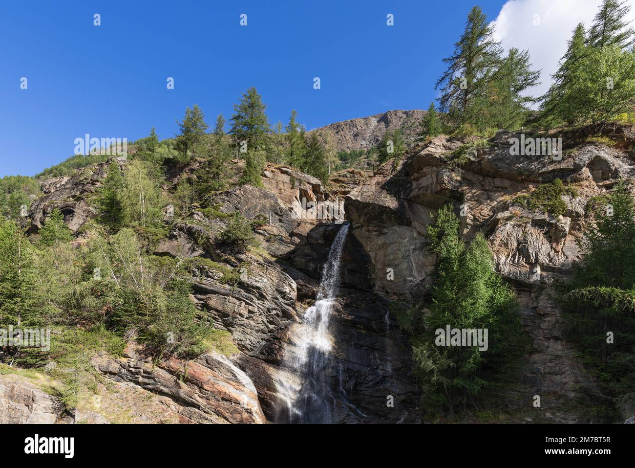 Centuries-old granite karst rocks have formed crevice in rock along ...