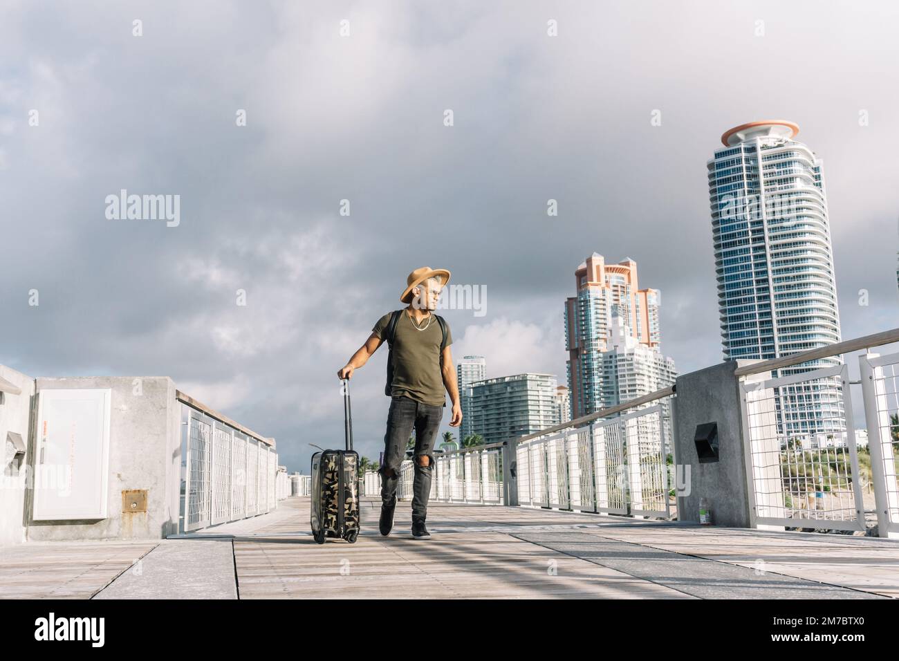 Male hipster traveller suitcase hi-res stock photography and images - Alamy