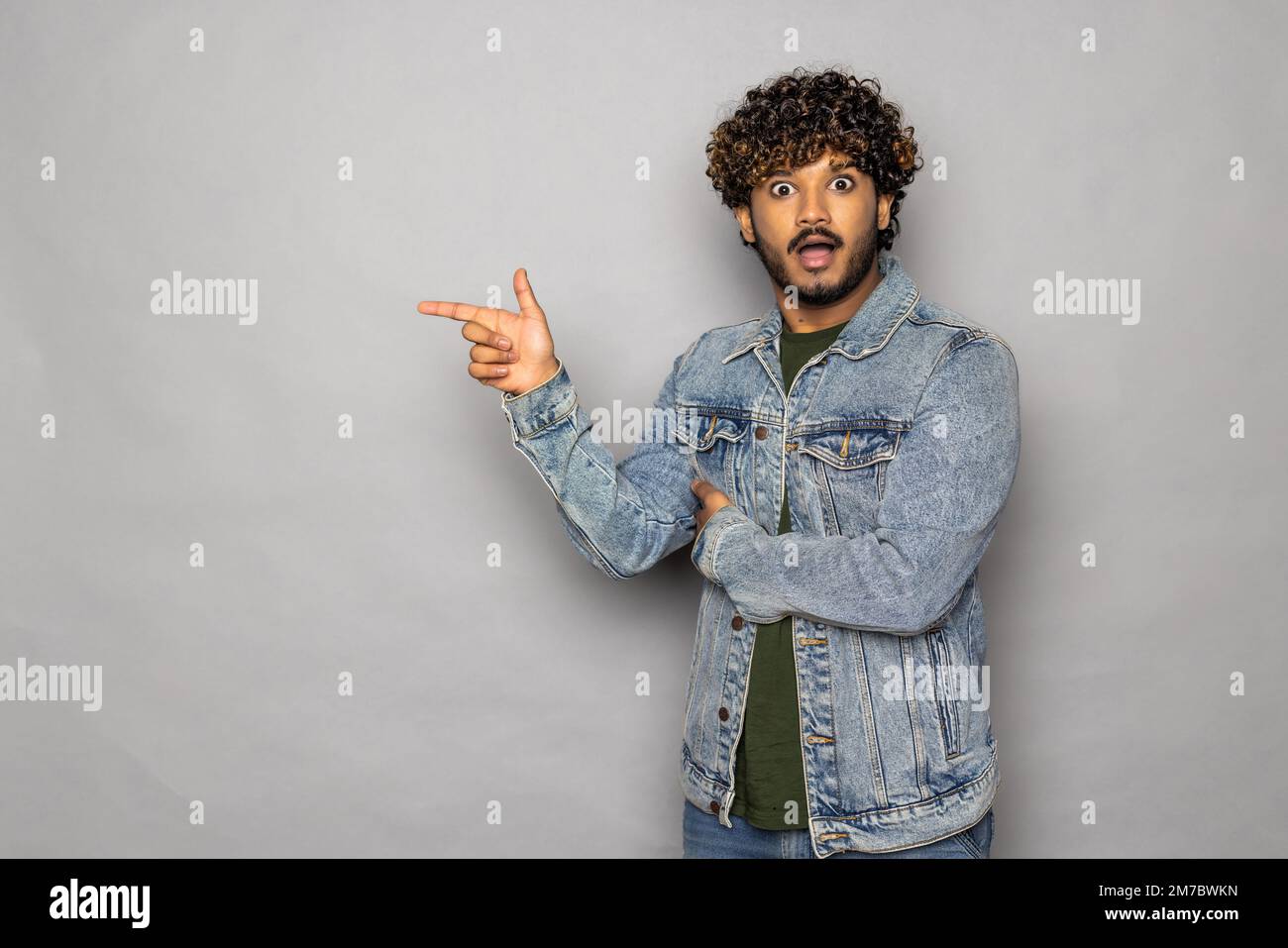 Happy indian business man salesman looking pointing fingers hand ...