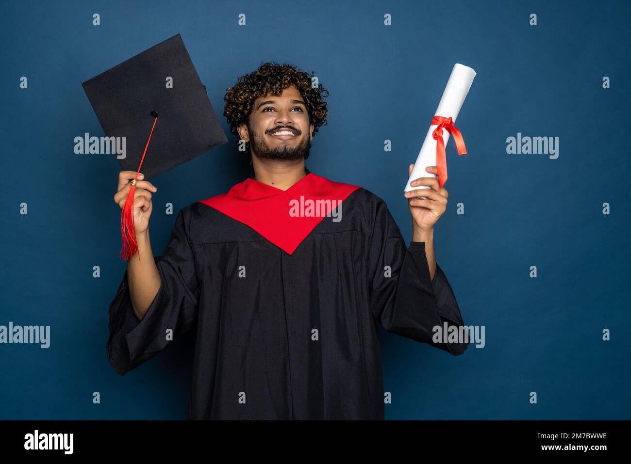 education, graduation and people concept - happy Indian Male graduate ...