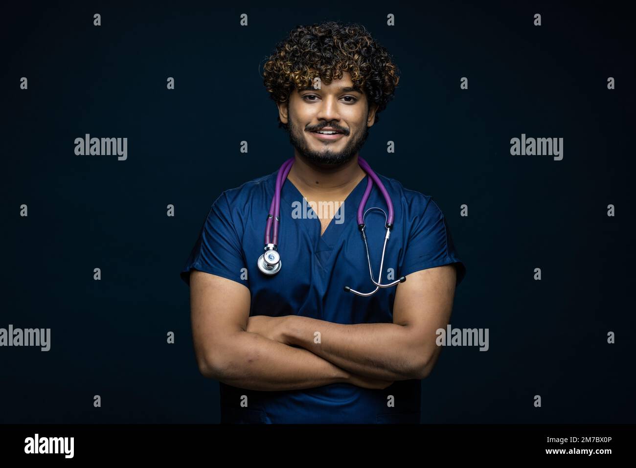 cute smiling indian doctor or surgeon in black uniform with stethoscope ...