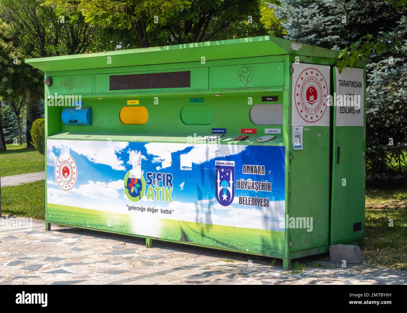Large color-marked separate waste disposal stations. textile, glass ...