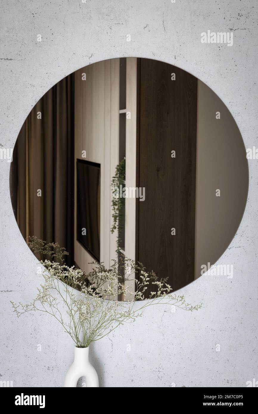 Reflection of modern living room in mirror Stock Photo - Alamy