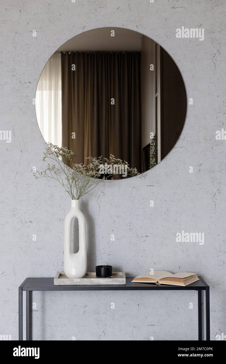 Reflection of modern living room in mirror Stock Photo - Alamy