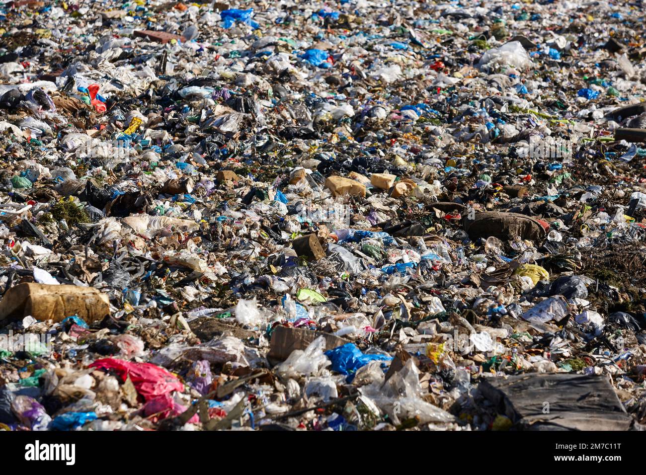 Open air garbage dump. Plastic pollution. Recycling junk. Consumerism ...