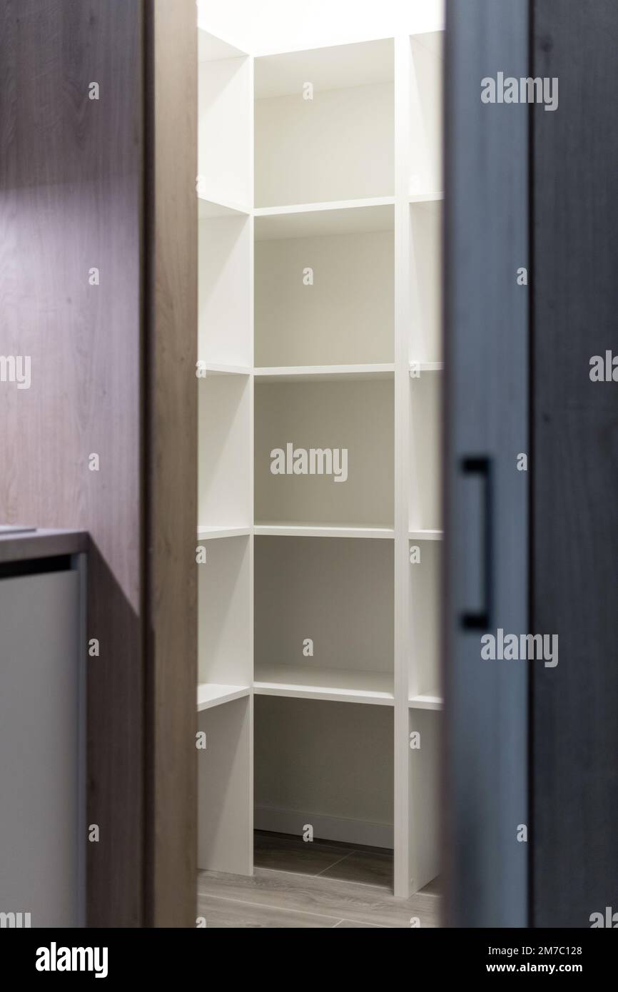Empty shelves of cabinet in storage room by the kitchen Stock Photo - Alamy