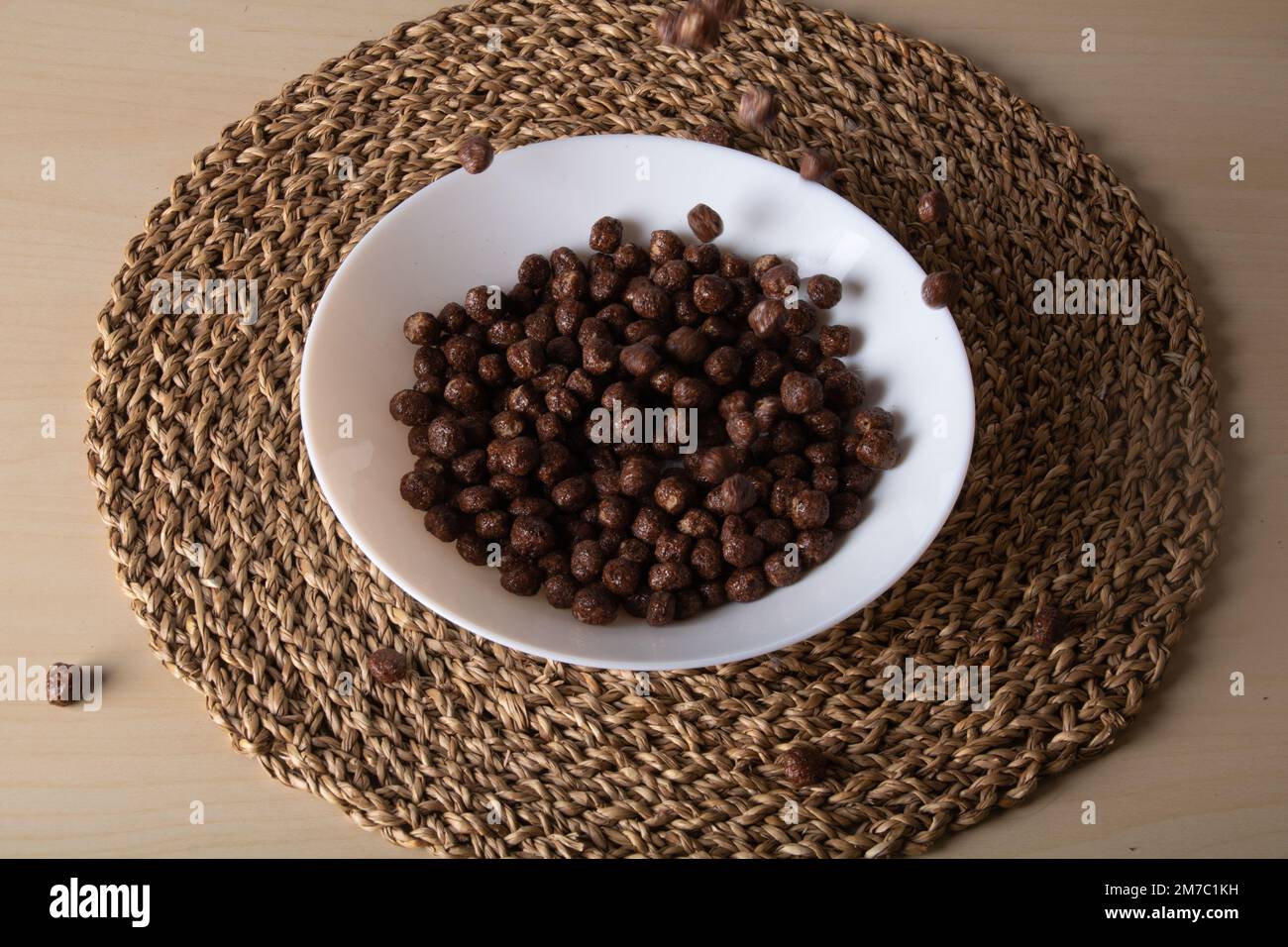 photo round chocolate balls in a plate on a wicker base Stock Photo - Alamy