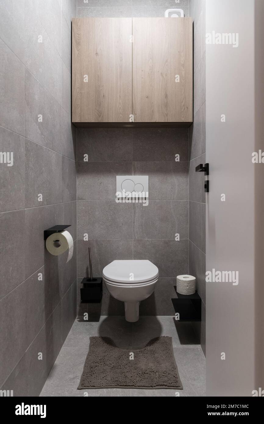 Small restroom of modern apartment Stock Photo - Alamy