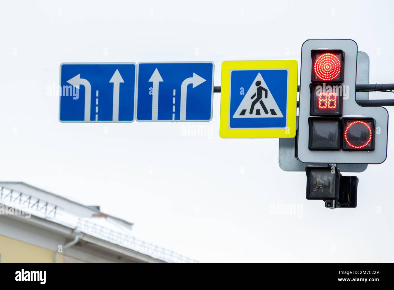 Road signs indicating the direction of movement, traffic lights with ...