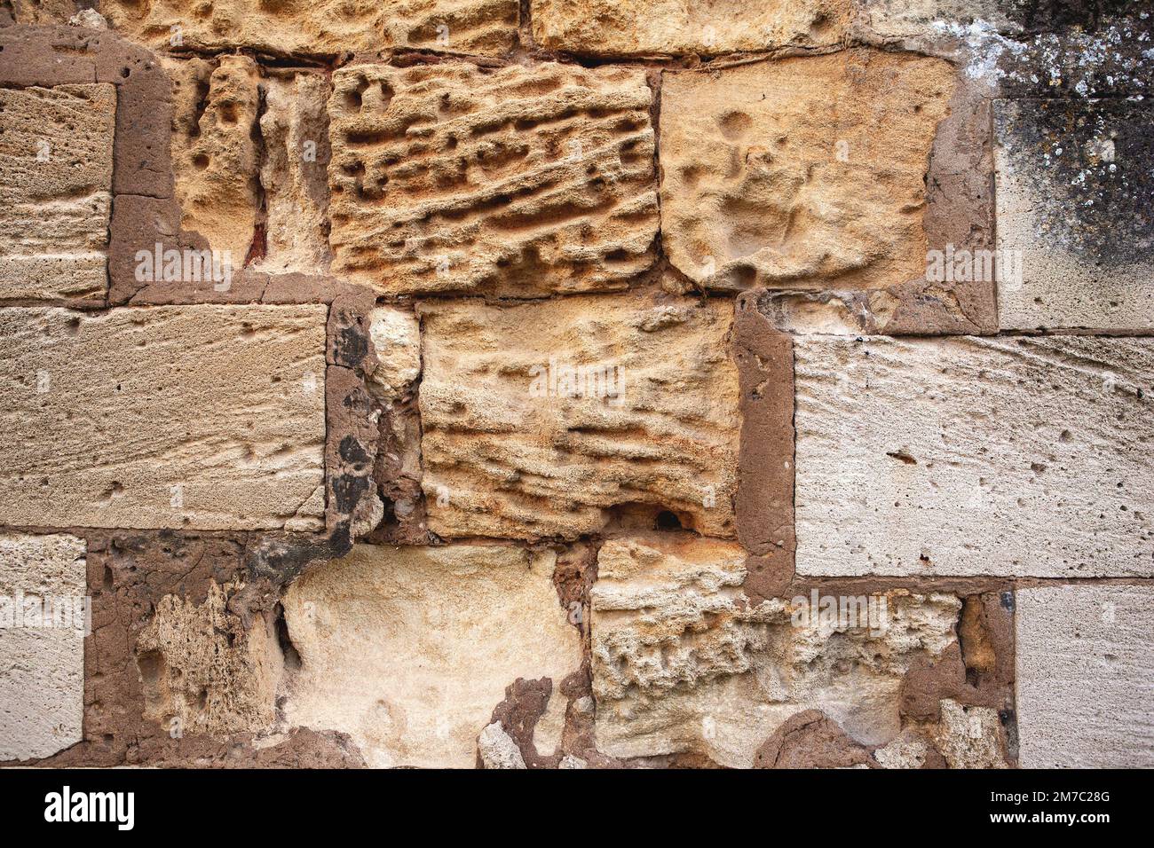 Background of new and damaged stones Stock Photo - Alamy