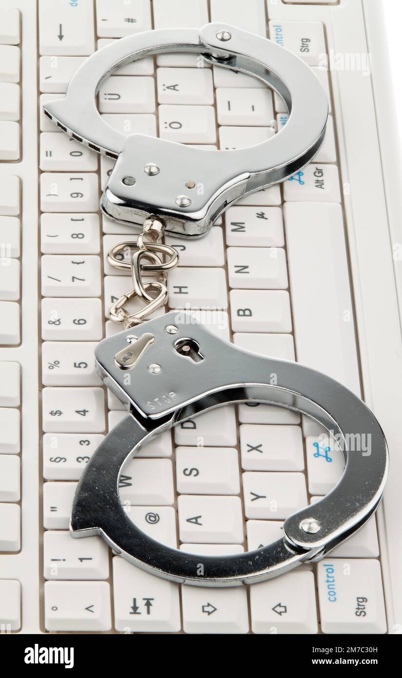 keyboard with handcuff Stock Photo - Alamy