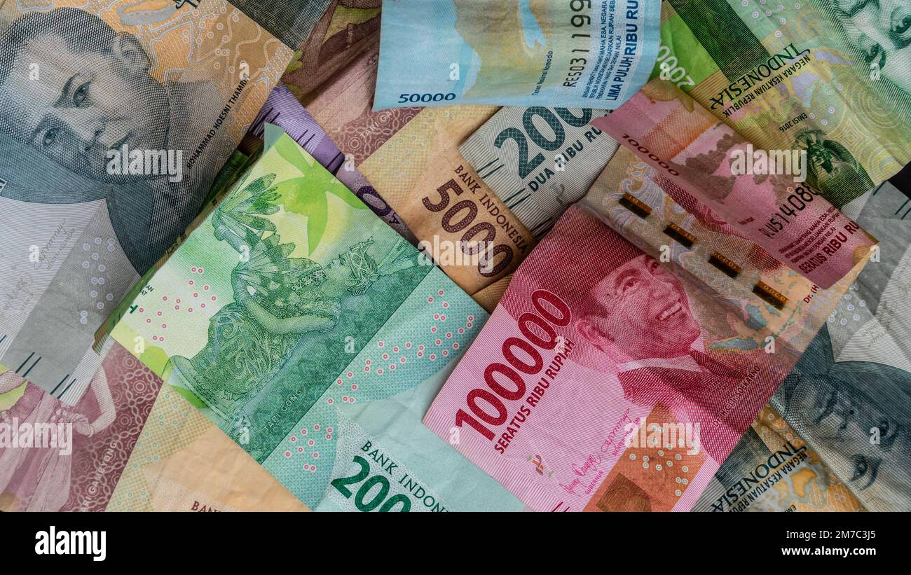 pile of rupiah banknotes as background Stock Photo - Alamy