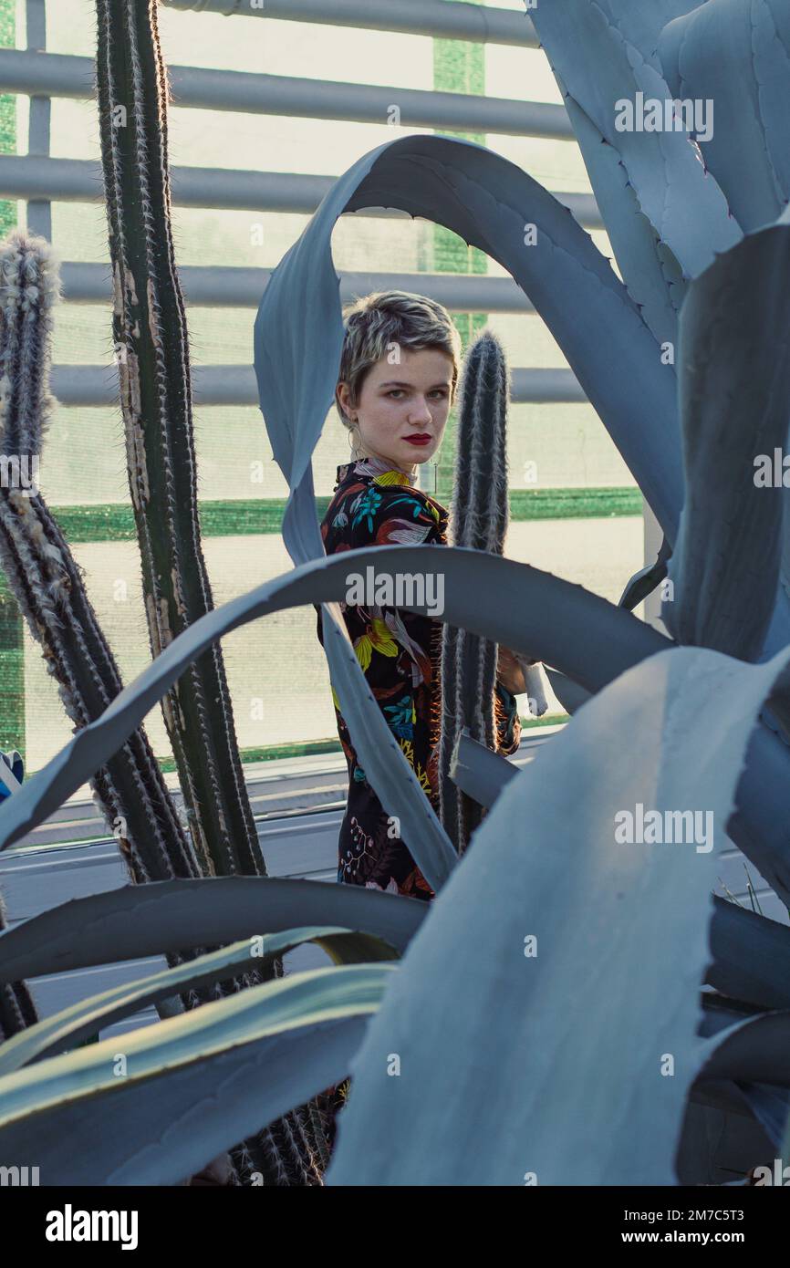 Attractive female model and plants in botanical garden portrait picture ...