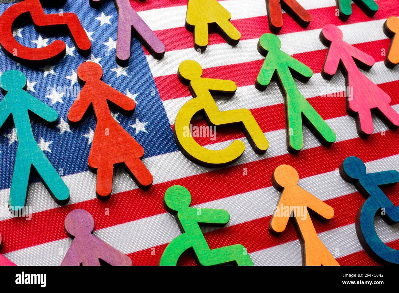 US flag and multi-colored figures with the symbol of a disability ...