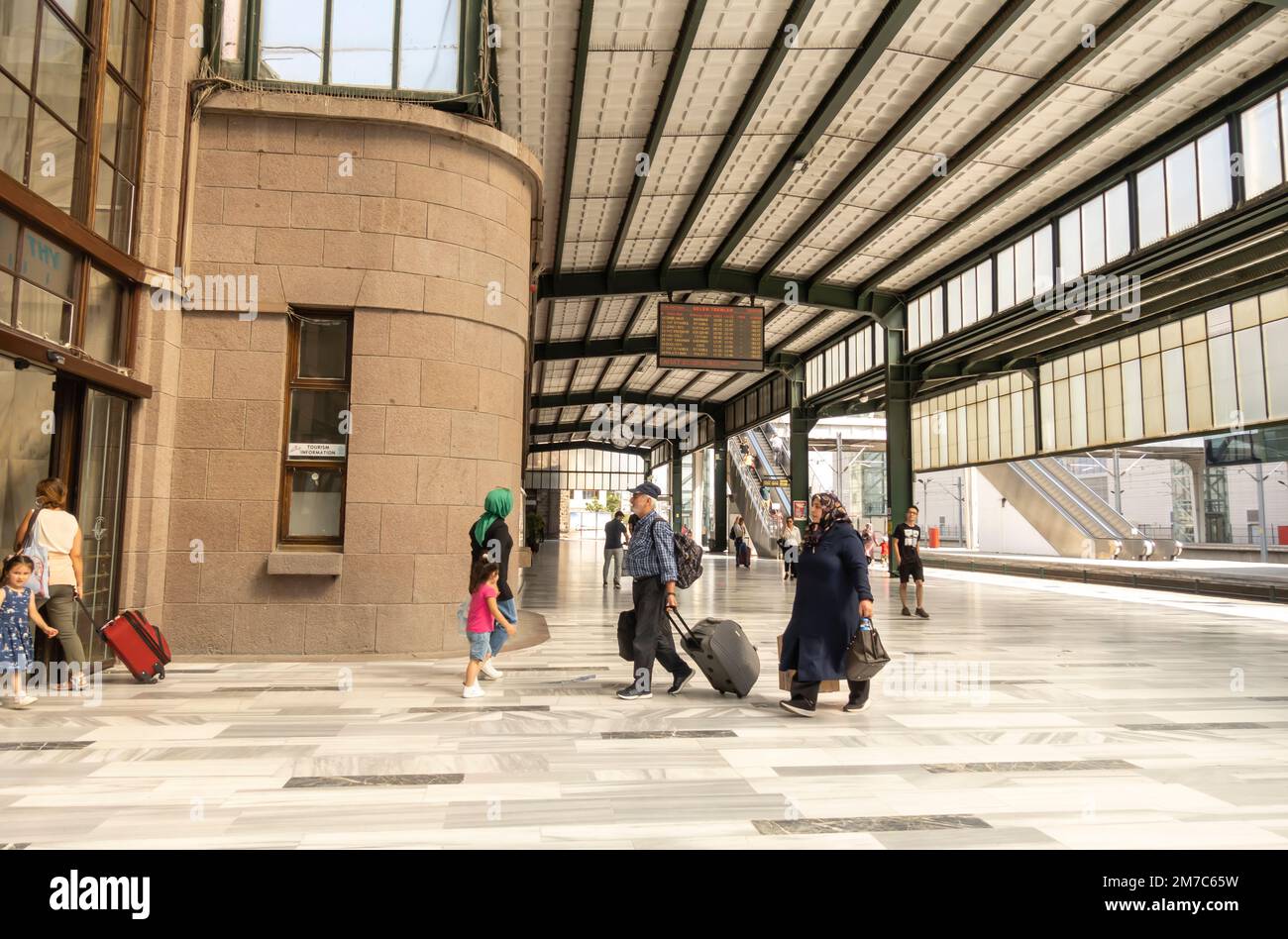 Passengers with luggage arriving walking in Ankara train station ...