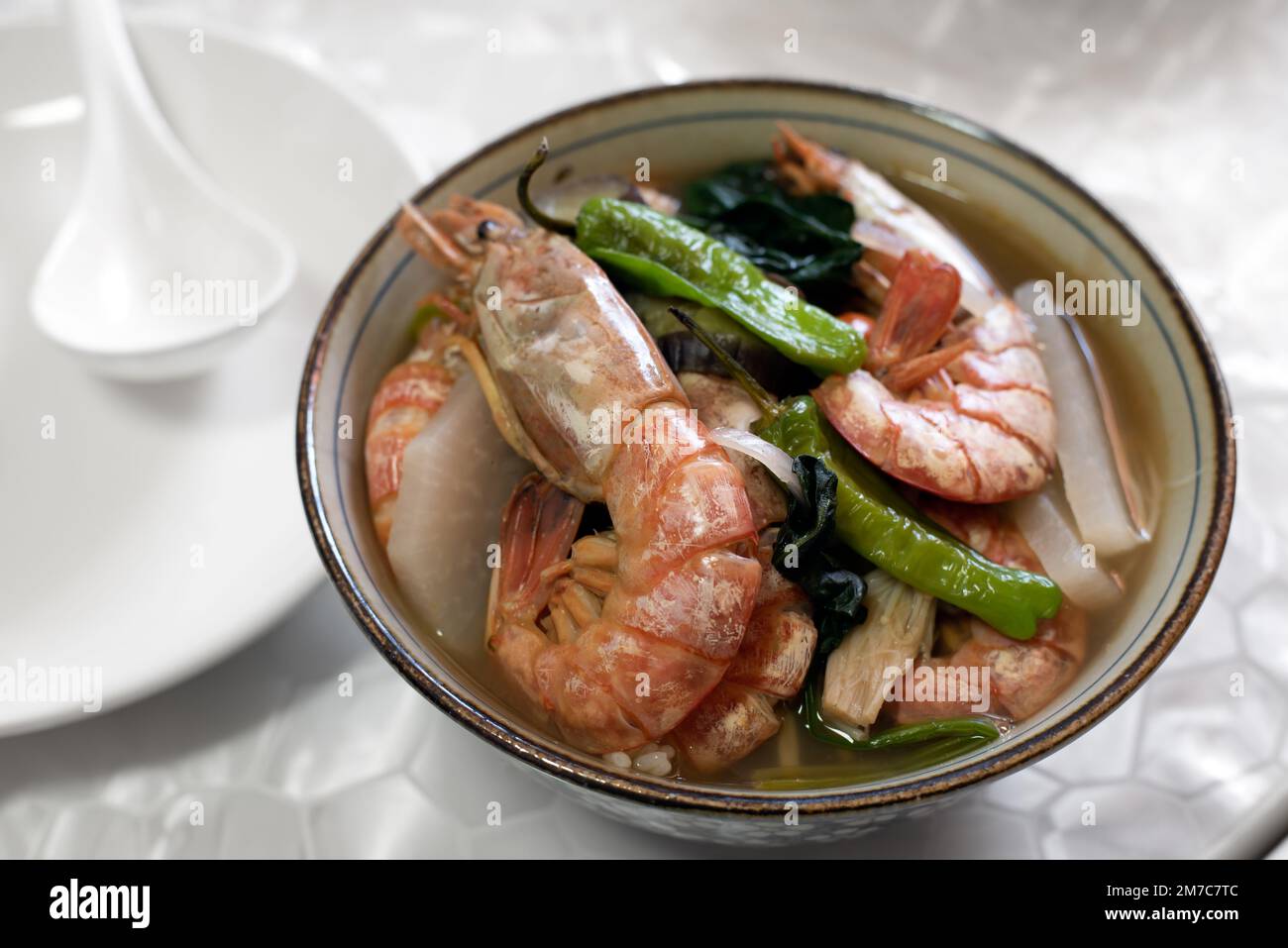 Sinigang na hipon - A Filipino dish of shrimp in a sour broth soup Stock Photo - Alamy