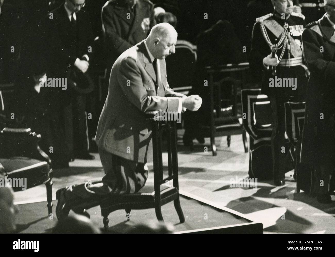 French General and politician President Charles De Gaulle praying in a ...