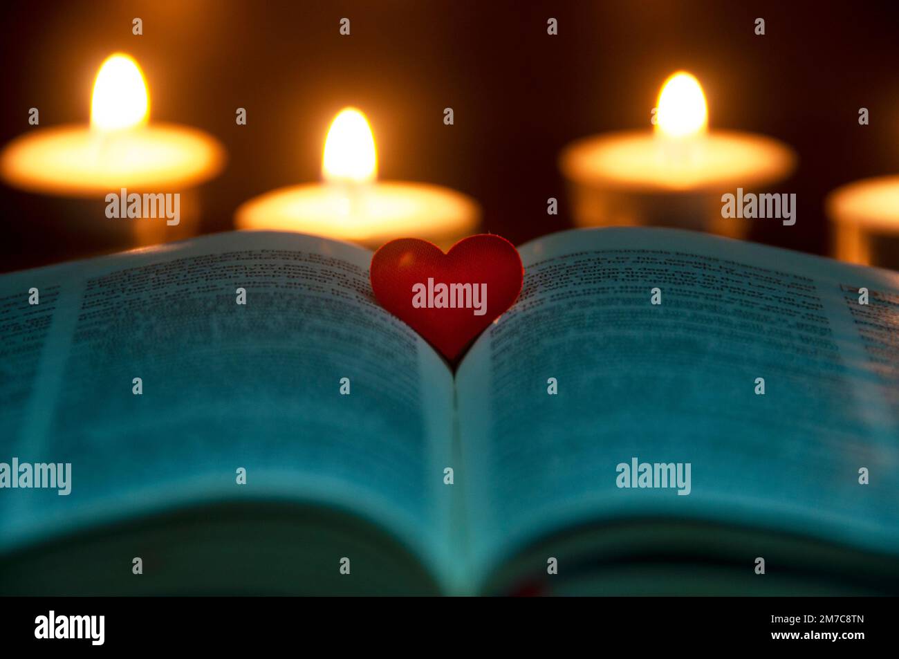 Red heart shape on Holy Bible with customizable space for text or ideas ...