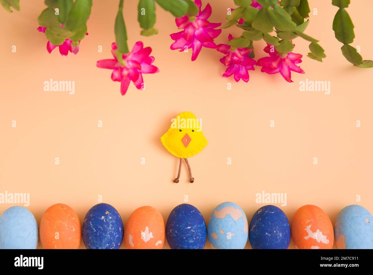 Easter eggs and chick. layout on a beige background blooming flower ...