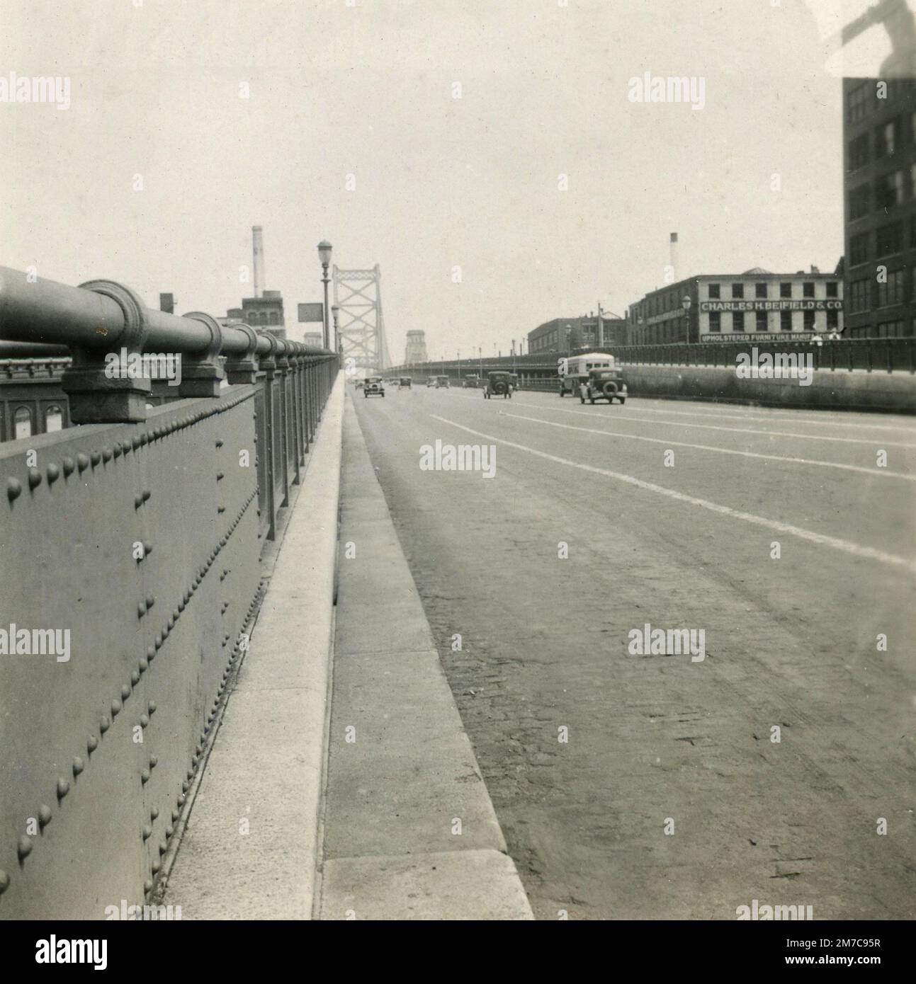 Cars and busses passing by Benjamin Franklin Bridge, Philadelphia USA ...