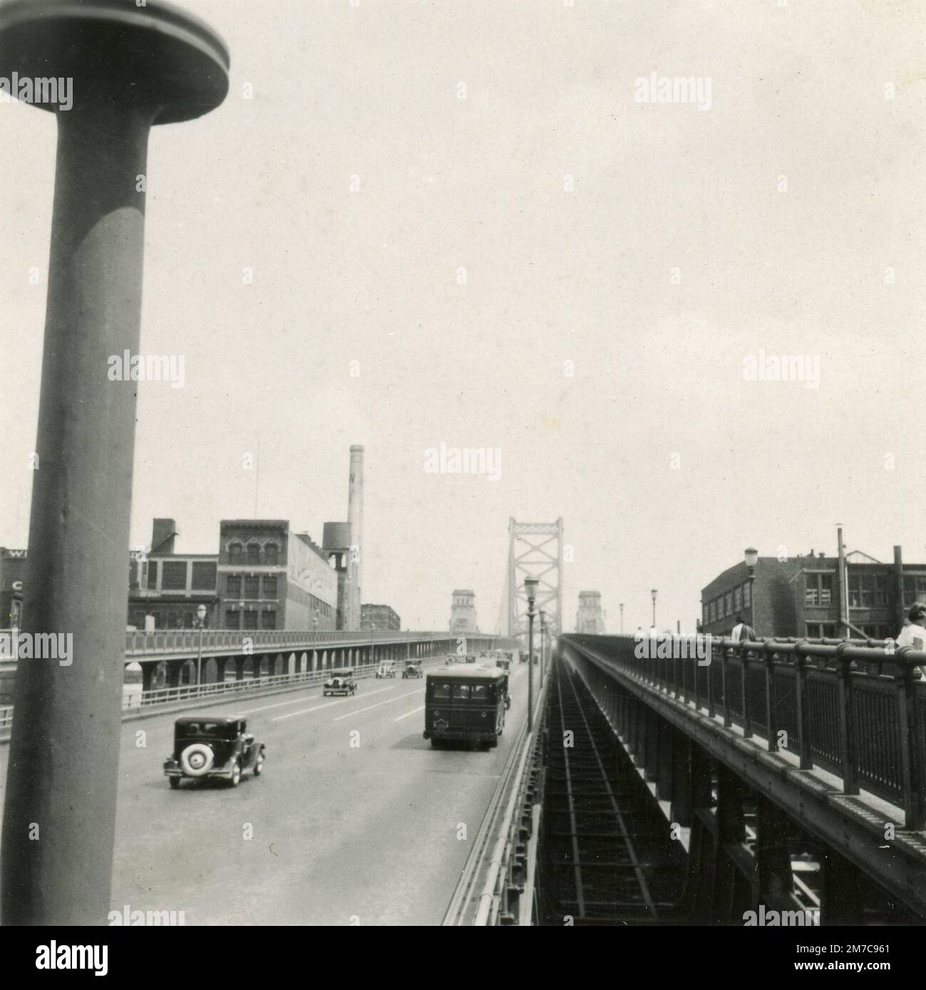 Cars and busses passing by Benjamin Franklin Bridge, Philadelphia USA ...