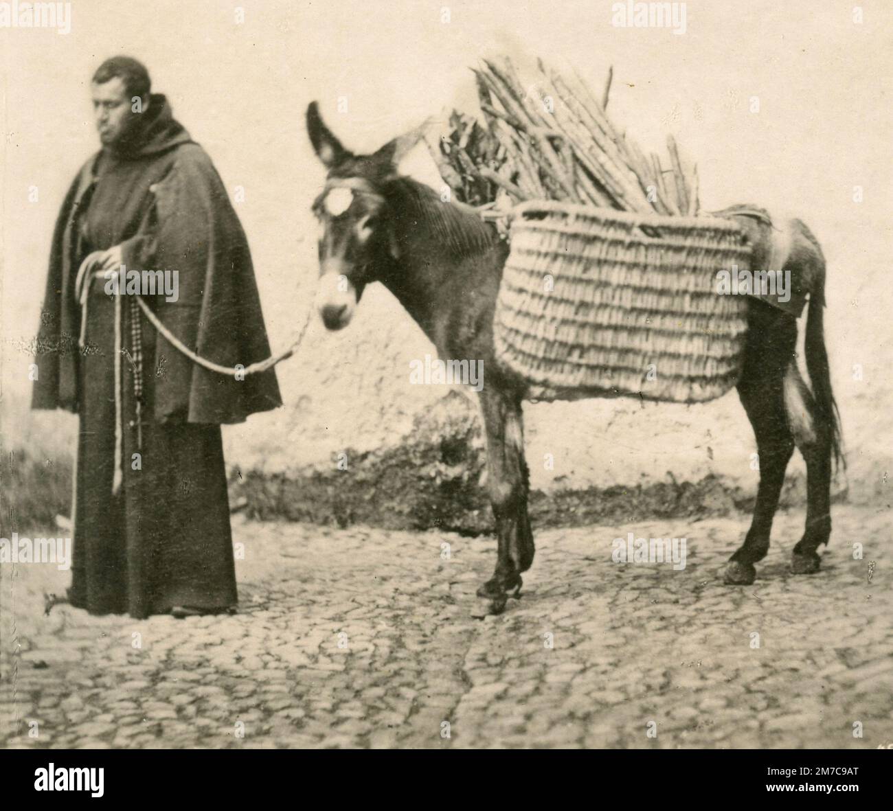 Friar walking a donkey, Italy 1920s Stock Photo - Alamy