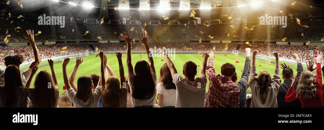 Back view of football, soccer fans emotionally cheering their team at ...