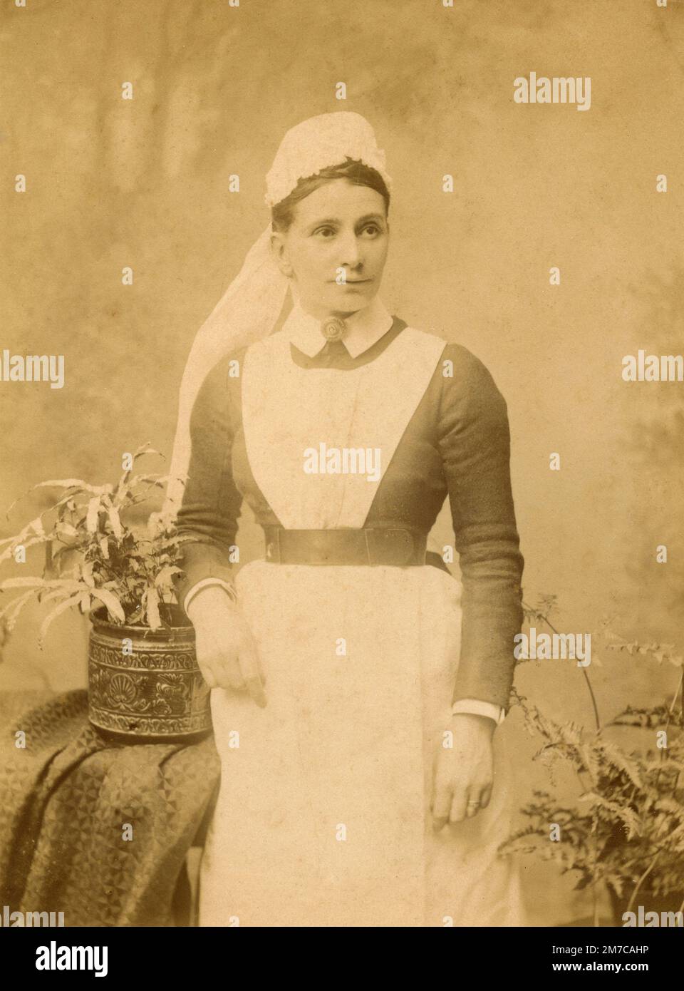 Studio portrait of a nurse, UK 1900s Stock Photo - Alamy