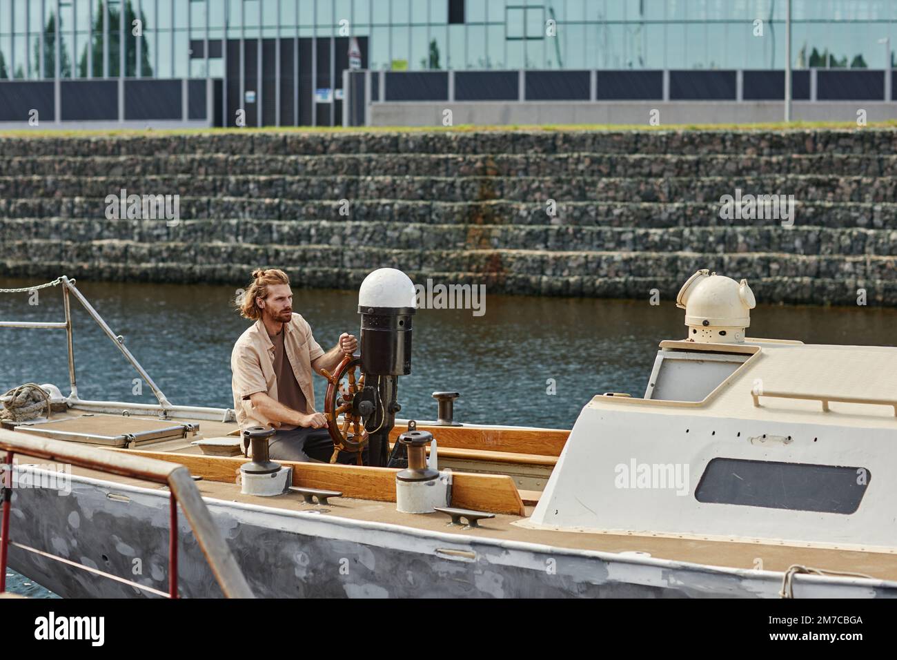 Young man on ship hi-res stock photography and images - Alamy