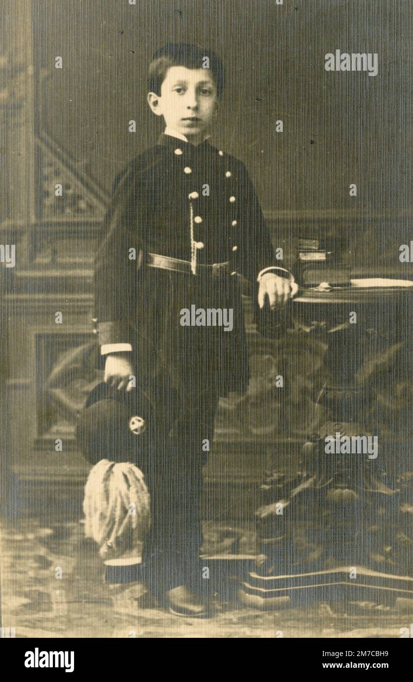 Studio portrait of a child wearing a uniform, Italy 1910s Stock Photo ...