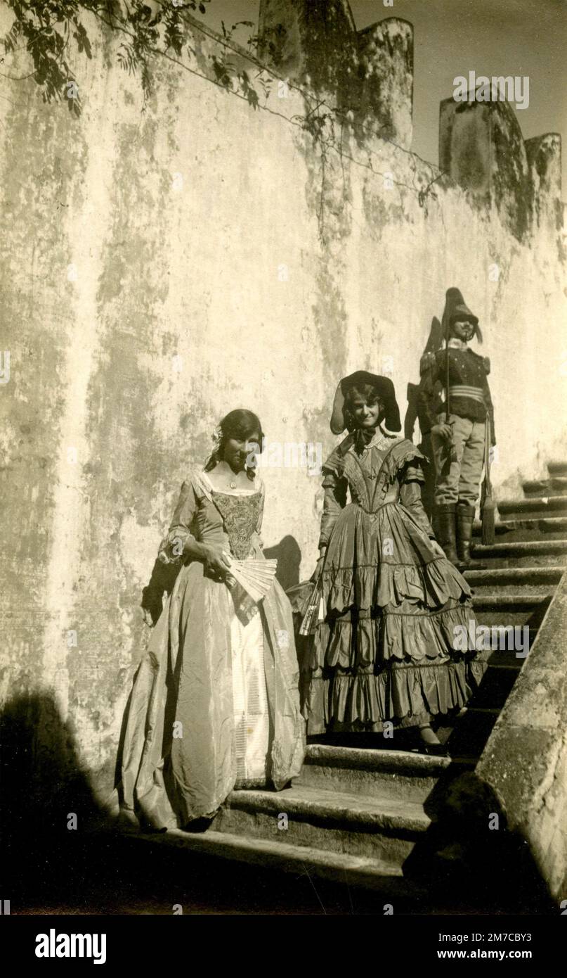 Two girls dressed with the 18th century costumes in a castle, Italy ...