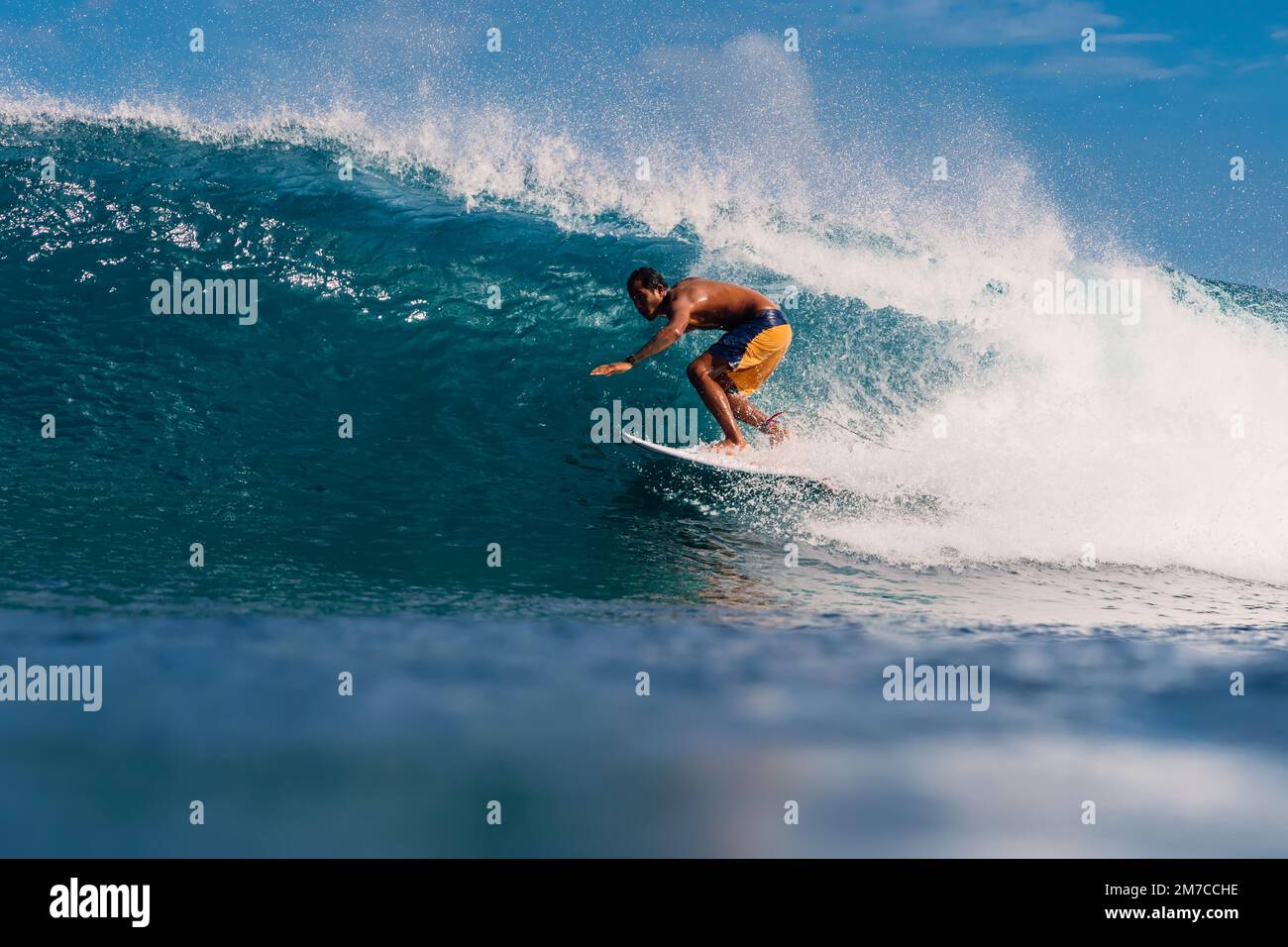 January 4, 2023. Bali, Indonesia. Man in tropical ocean during surfing ...