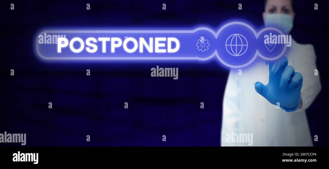 Sign displaying Postponed. Word Written on to place later in order of ...